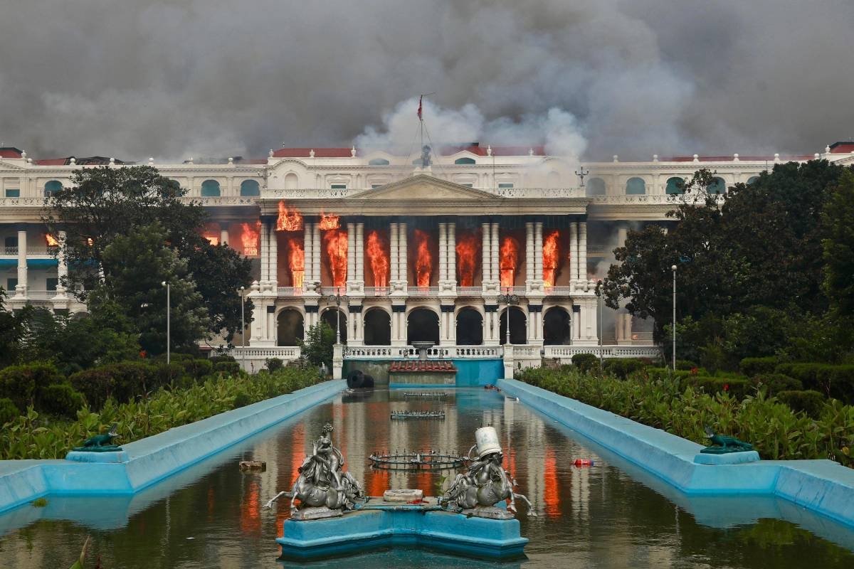 Nepal protesters set parliament ablaze as PM quits