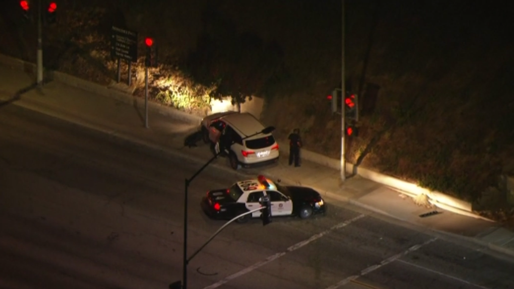 Pursuit with shooting suspect ends as car veers off 10 Freeway and ...