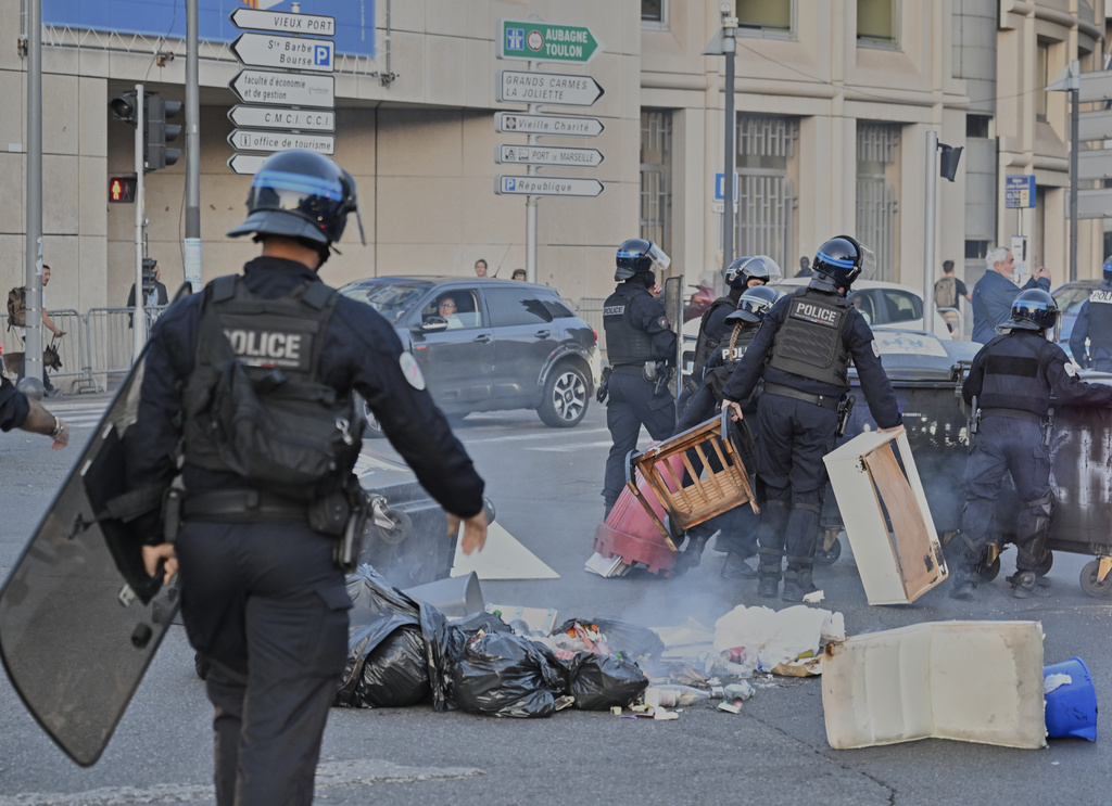 Protesters block roads and start fires across France to challenge the ...