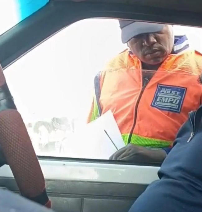 What was he giving police? Video sparks probe after hawker filmed ...