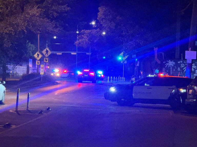 Suspect in custody after woman, Austin police officer shot