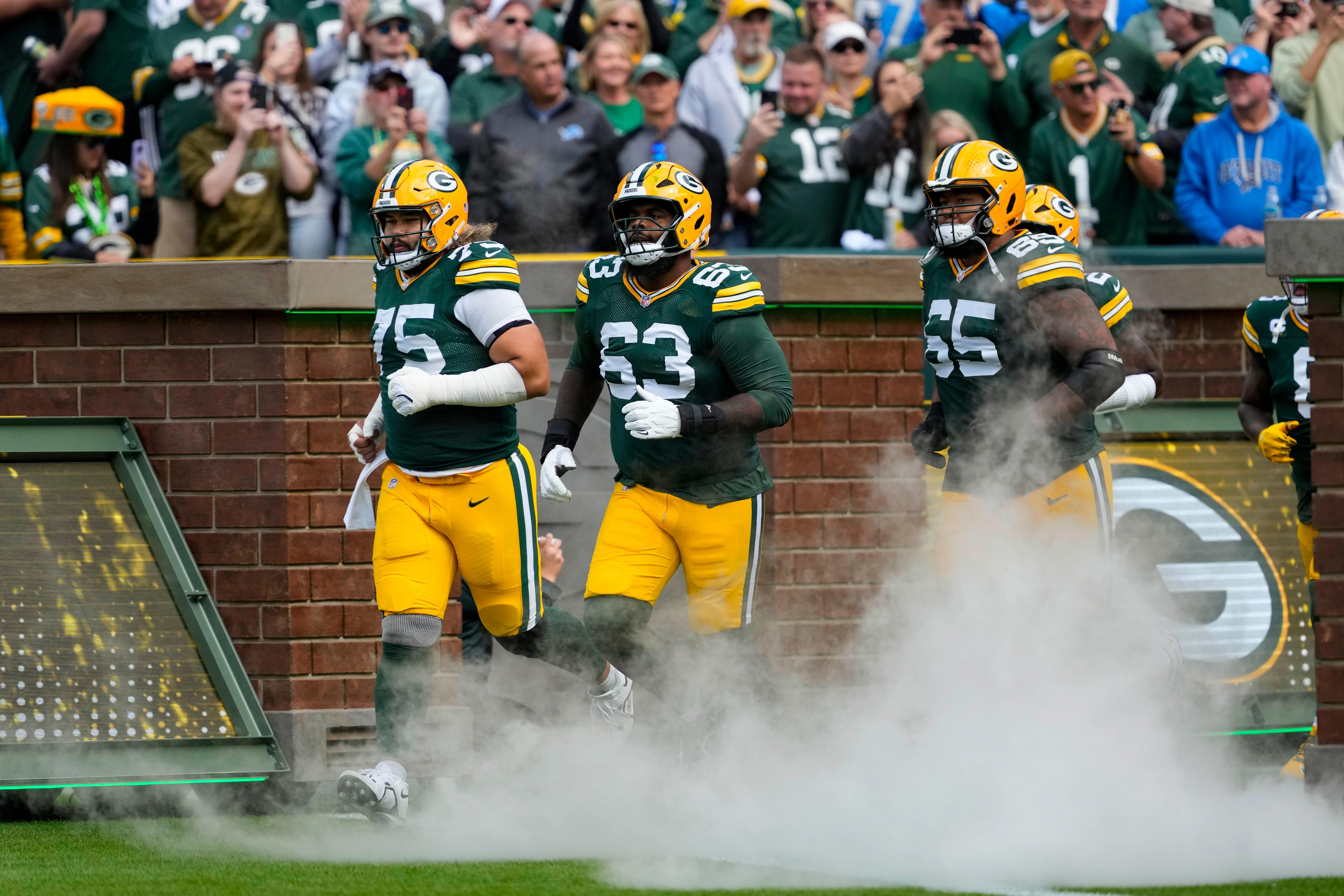 Packers OL Zach Tom, Aaron Banks avoided long-term injuries coming out ...