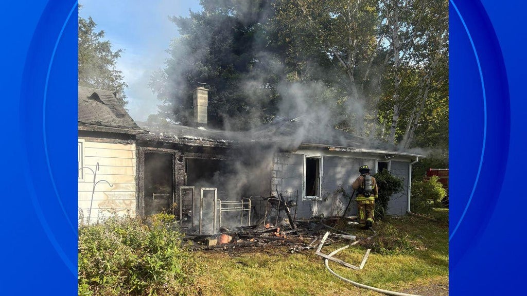 One person taken to hospital from the scene of a New Baltimore house fire