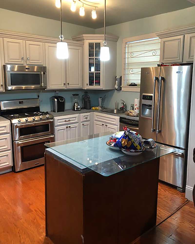 Stale White Kitchen Cabinets Go From Cheap to Chic in This Dramatic ...