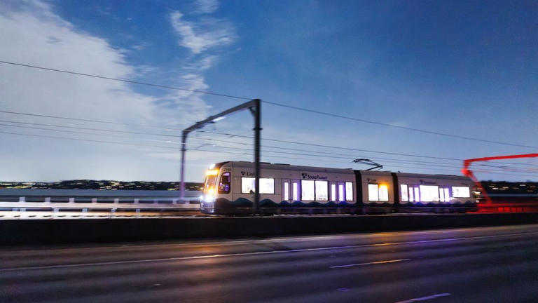 Sound Transit light rail train crosses I-90 floating bridge in historic ...