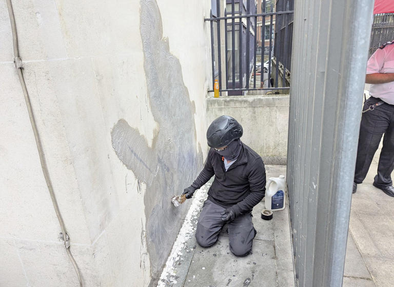 Banksy mural of a judge beating a protester is scrubbed from London court