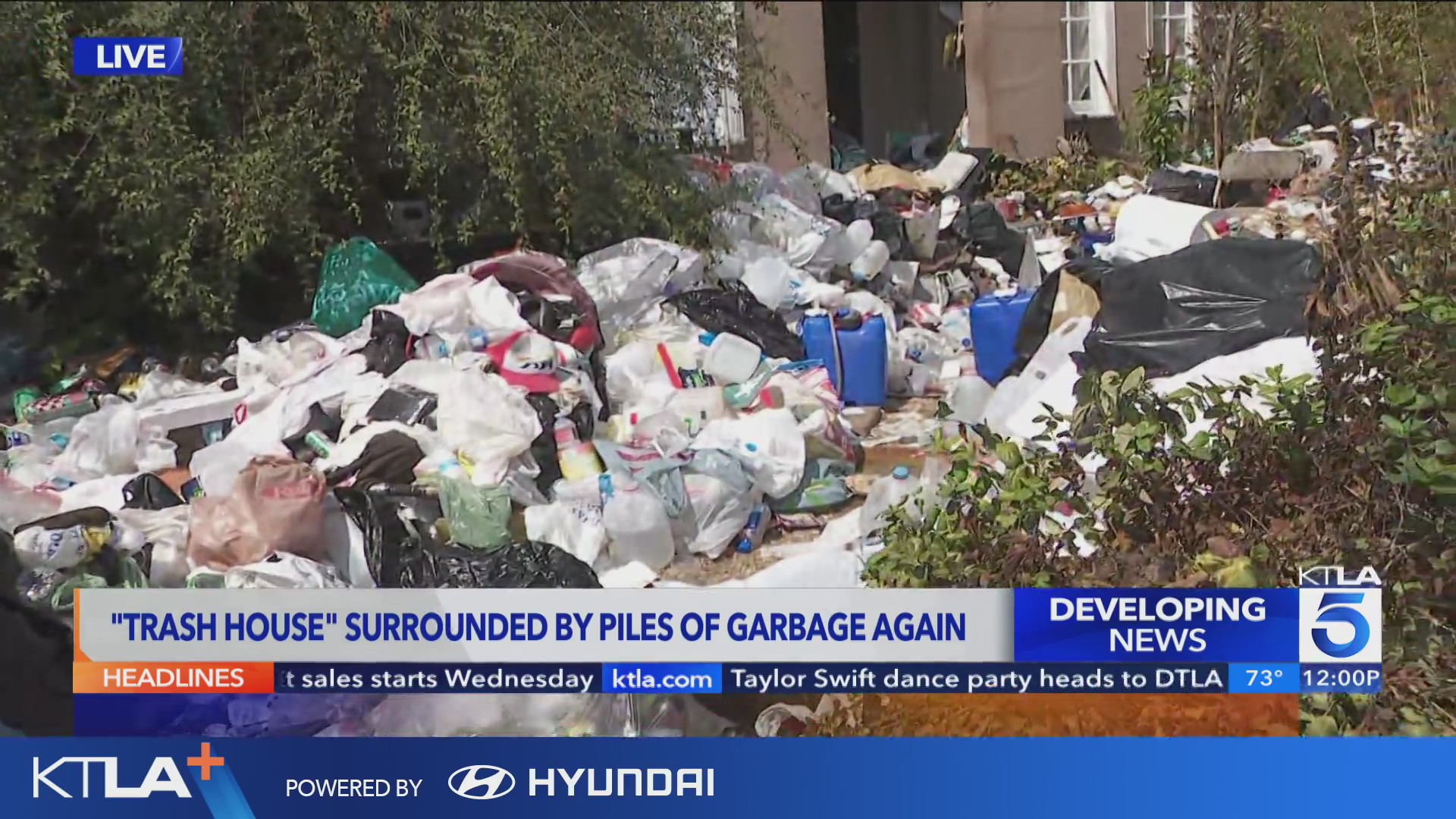 'Trash House' surrounded by piles of garbage again