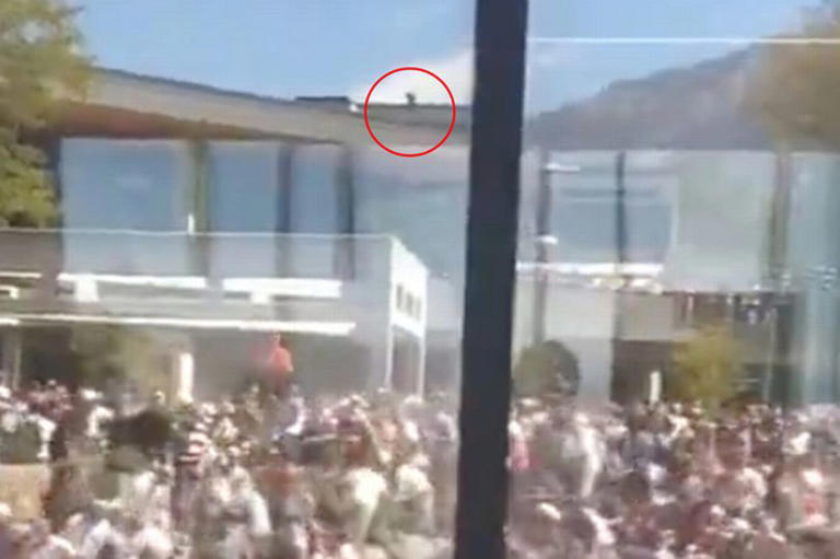 Charlie Kirk gunman appears to flee across roof after shooting at Utah ...