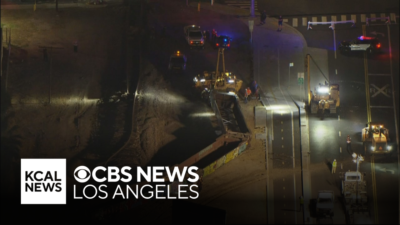 Abandoned train cars derail in Pomona