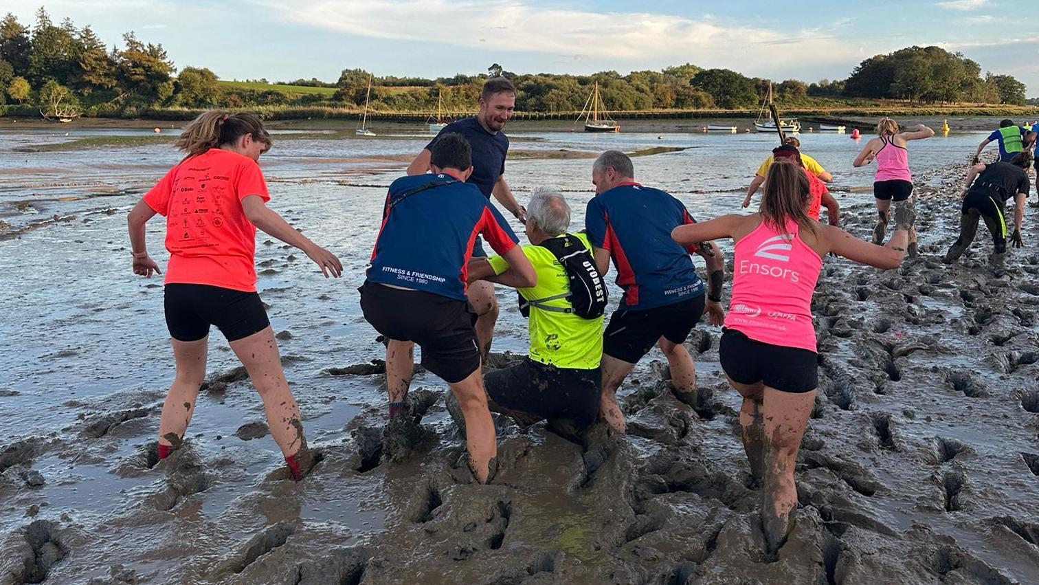 Sport club shuffles through mud for river run