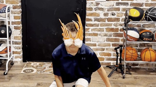 Shell Yeah! Kid Nails Basketball Dribble With Crab Legs Over His Eyes