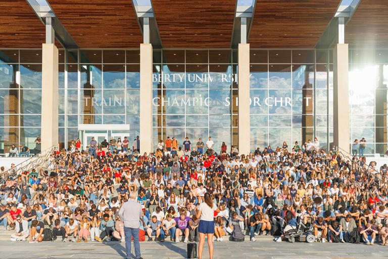 Liberty University students pray for slain activist Charlie Kirk ...