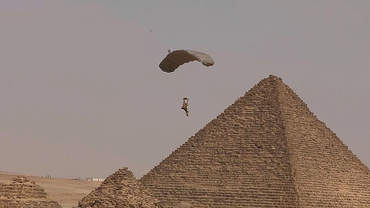 Military paratroopers perform dramatic jump over Egypt's Pyramids of Giza
