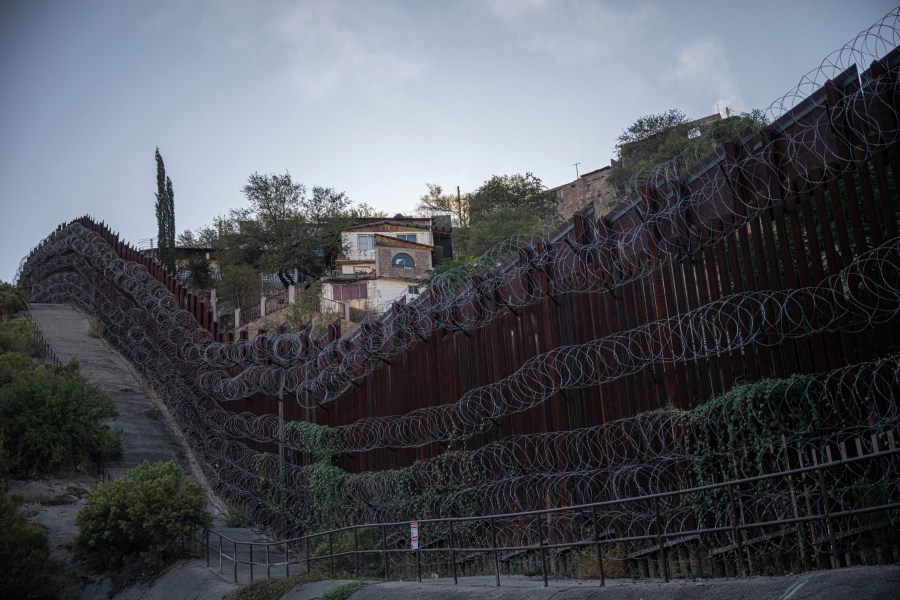 Border Patrol aims gun at dog, resident points gun at agent