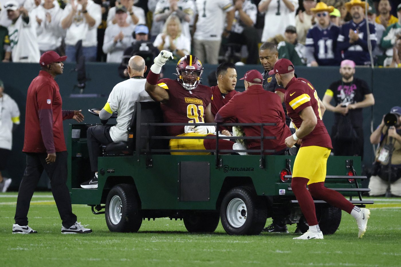 Commanders defensive end Deatrich Wise Jr. carted off the field with right quad injury vs. Packers