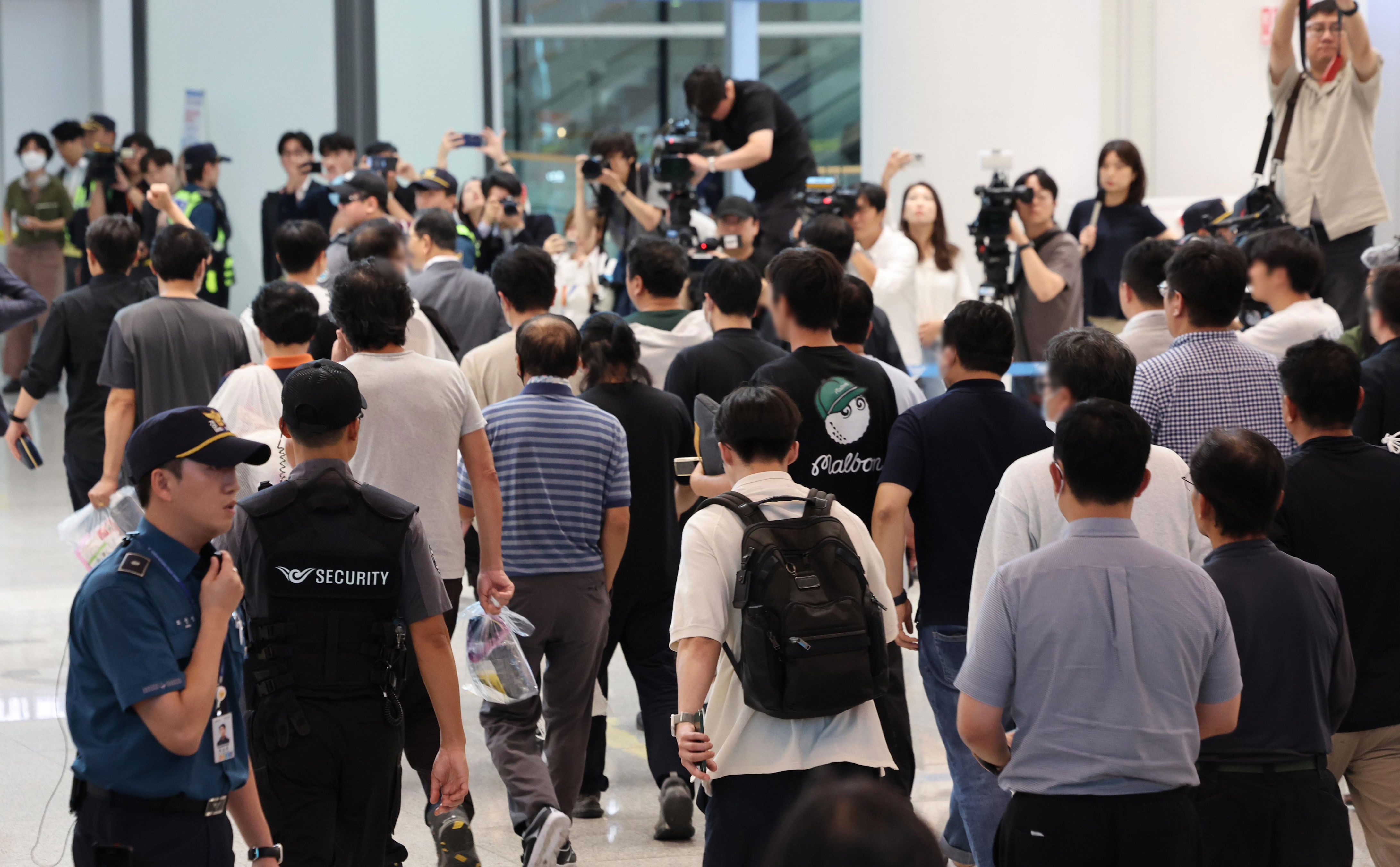 Georgia-detained South Korean workers return home