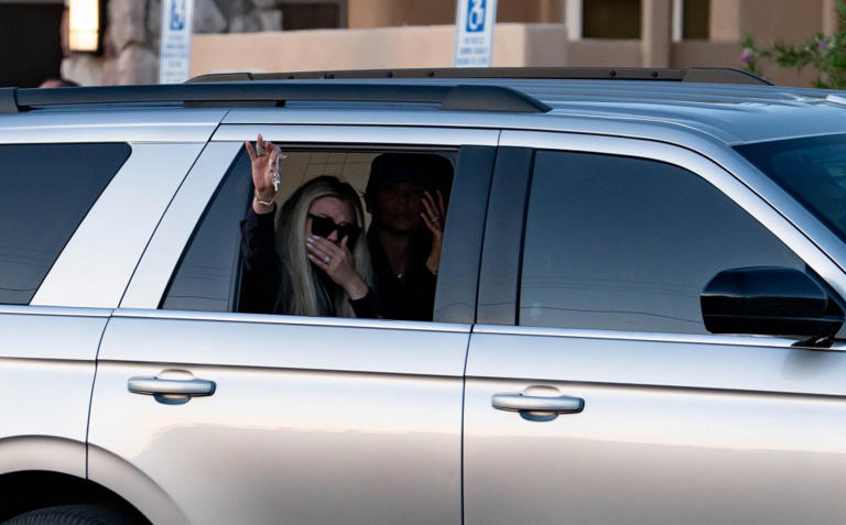 Charlie Kirk’s widow, Erika, fights back tears while waving to ...