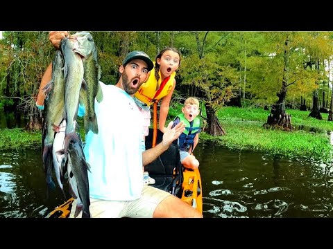 Children catch their largest fish ever during a swamp trip