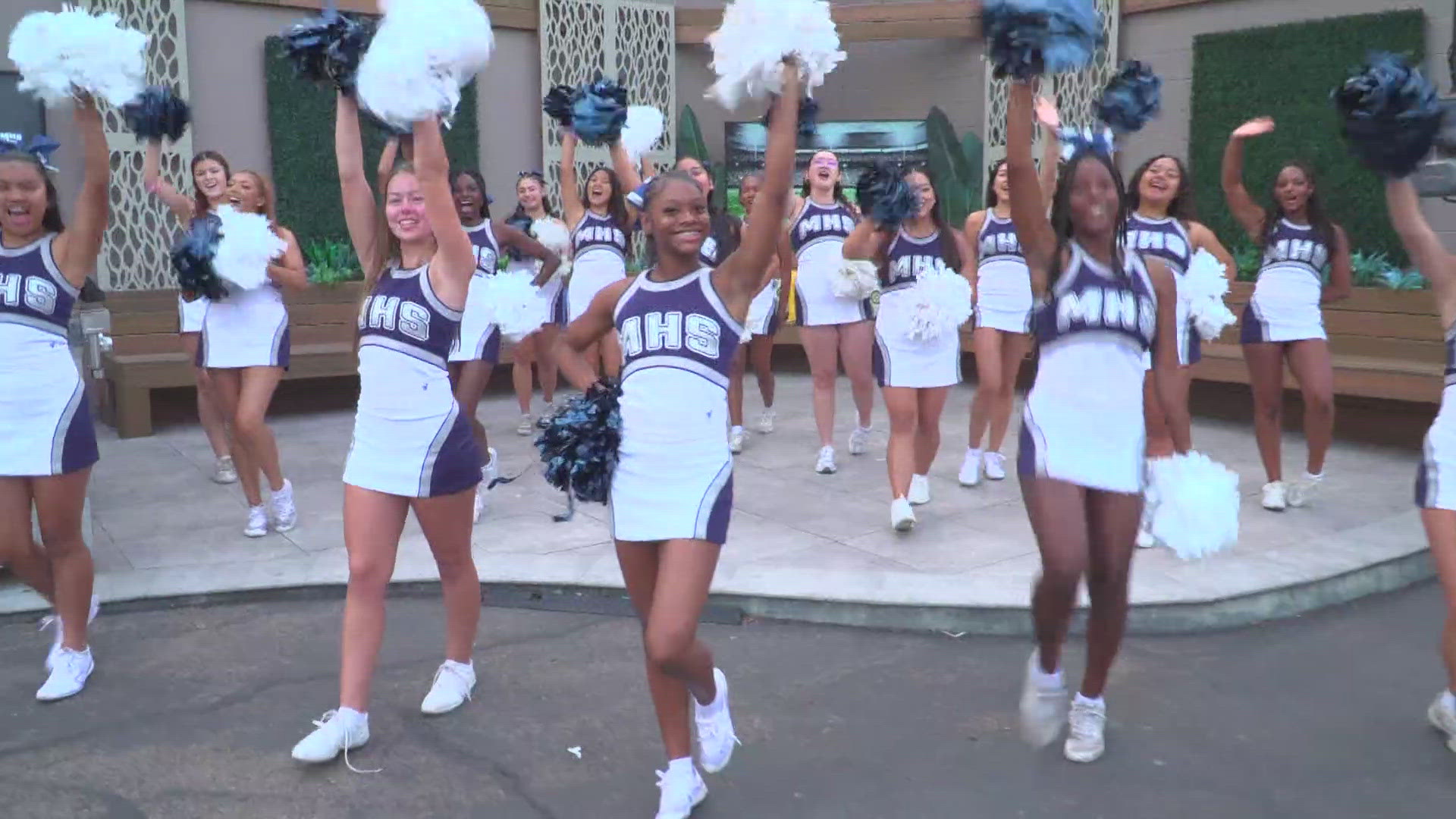 Madison Warhawks Cheer gets ready for Friday night football