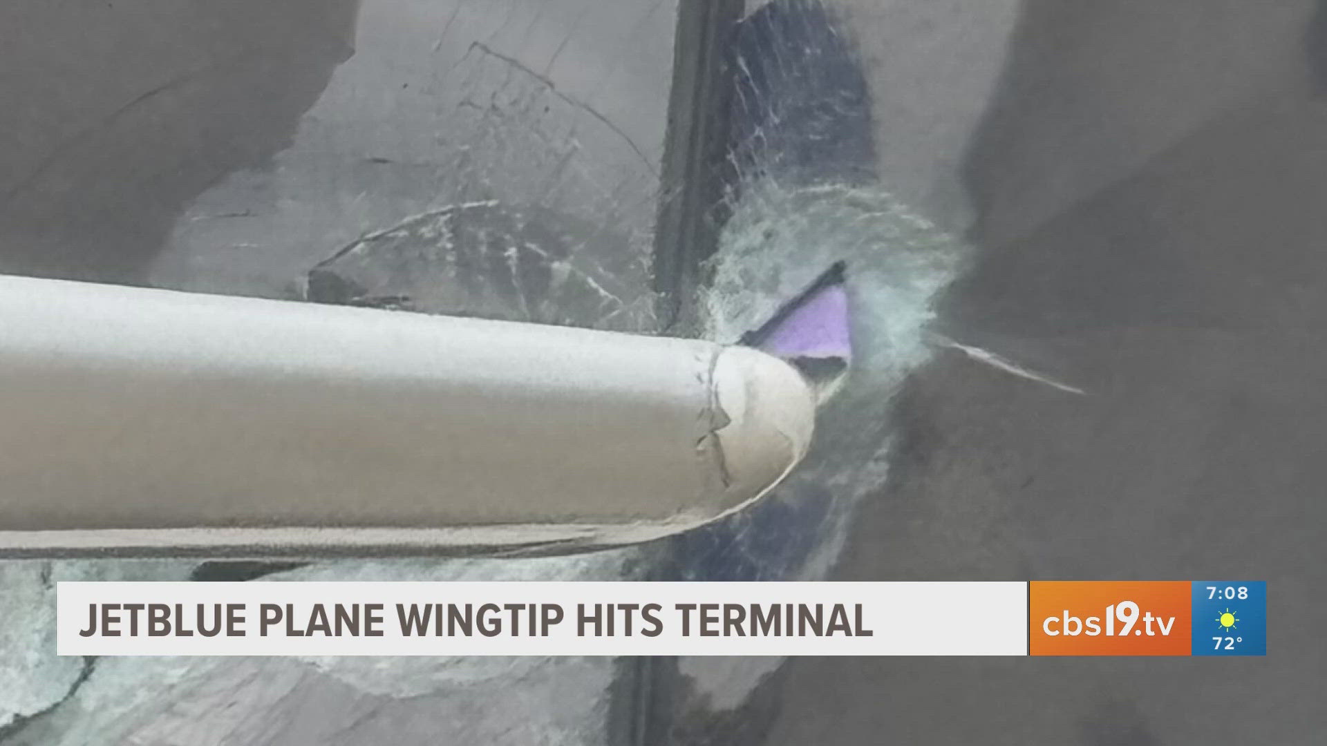 JetBlue wingtip hits terminal