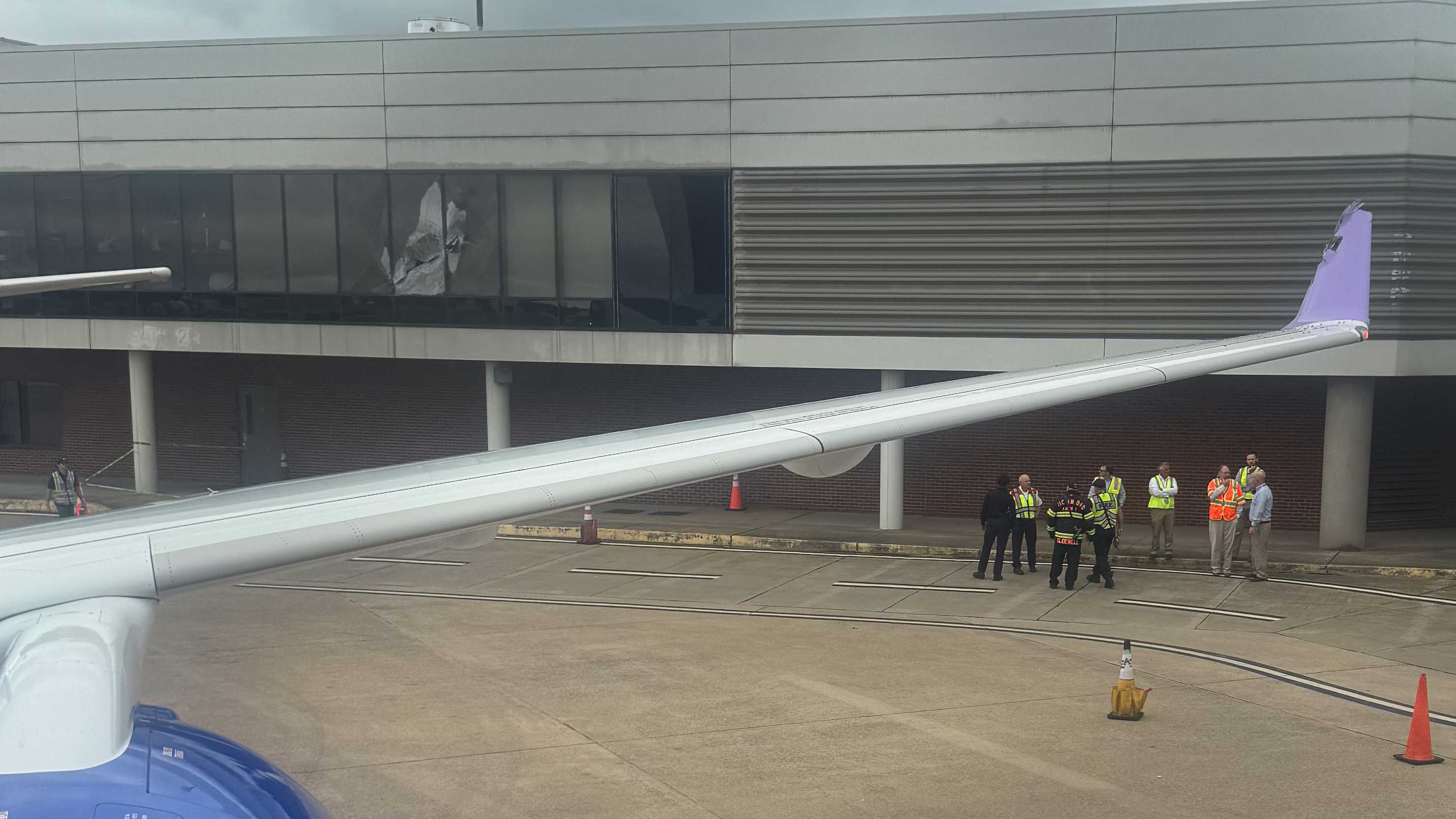 Wing of Boston-bound JetBlue plane strikes airport window