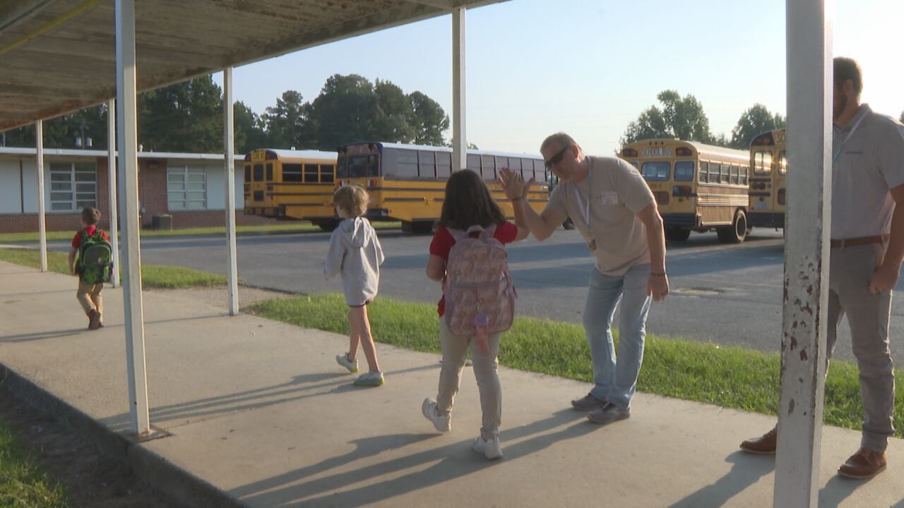 Northeast Elementary hosts “Dudes at the Door” initiative