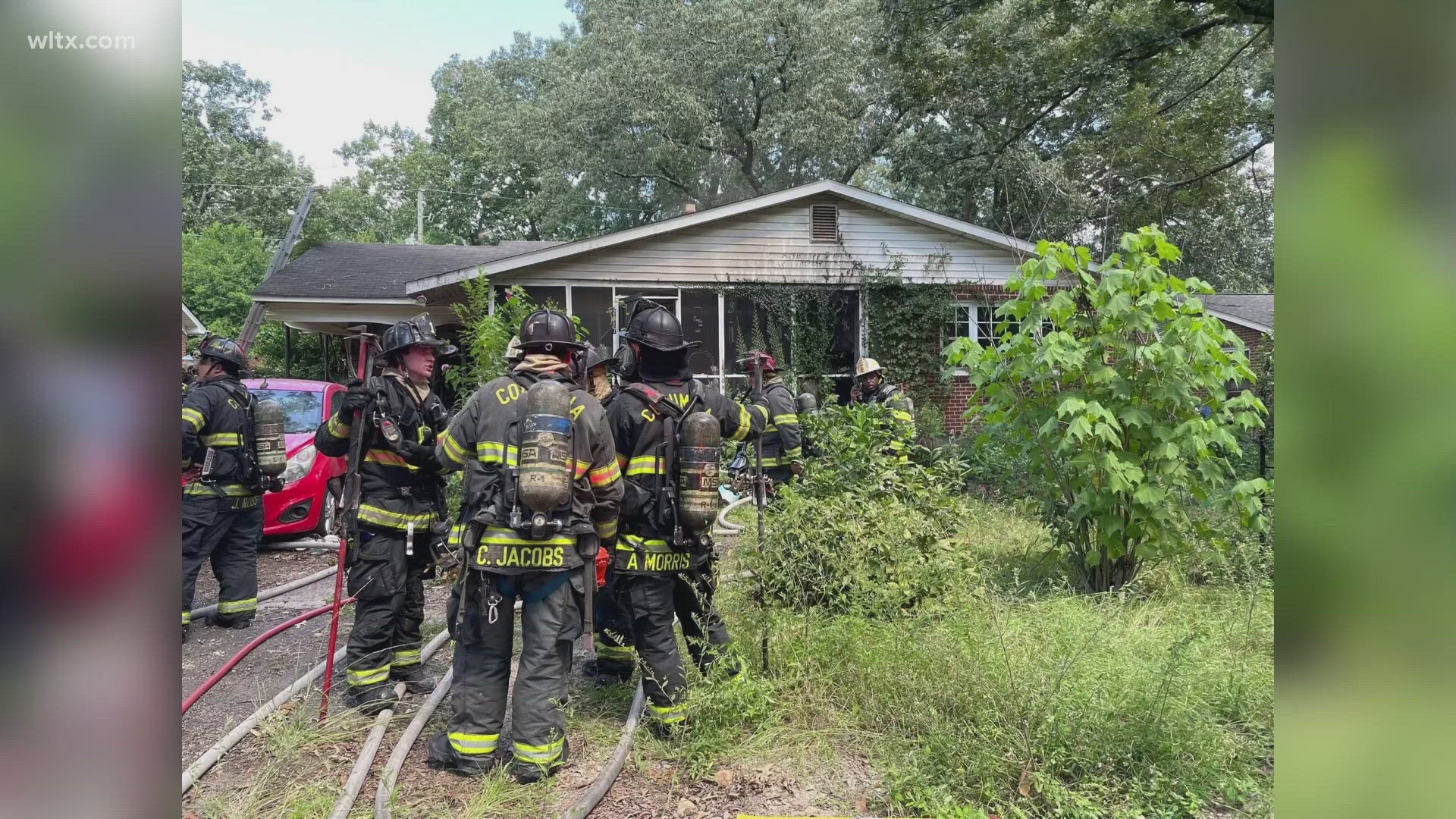 Firefighters battle house fire on Holt Drive