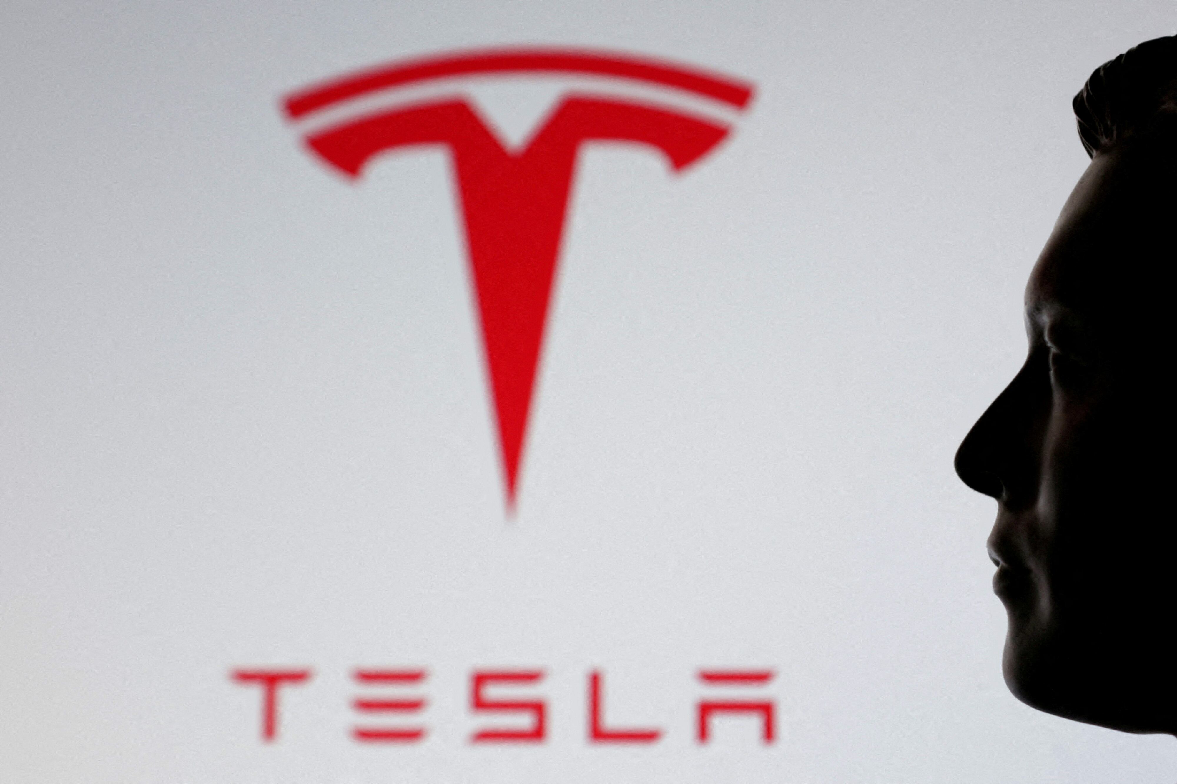 Tesla stock surges to seven-month high