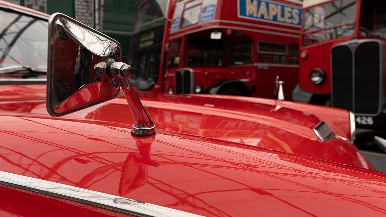 Why did classic cars come with fender-mounted mirrors?