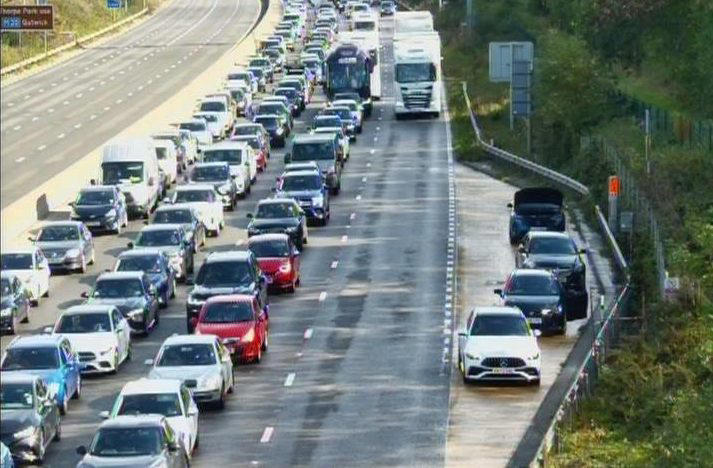 Drivers walk on major motorway and cars face wrong way