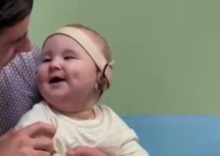 Baby born completely deaf hears his parents’ voices for the first time