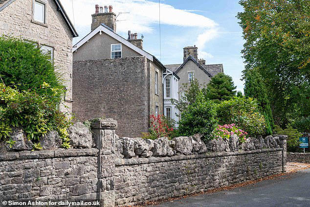 How homeowner went to war with neighbour nextdoor after building 20ft ...