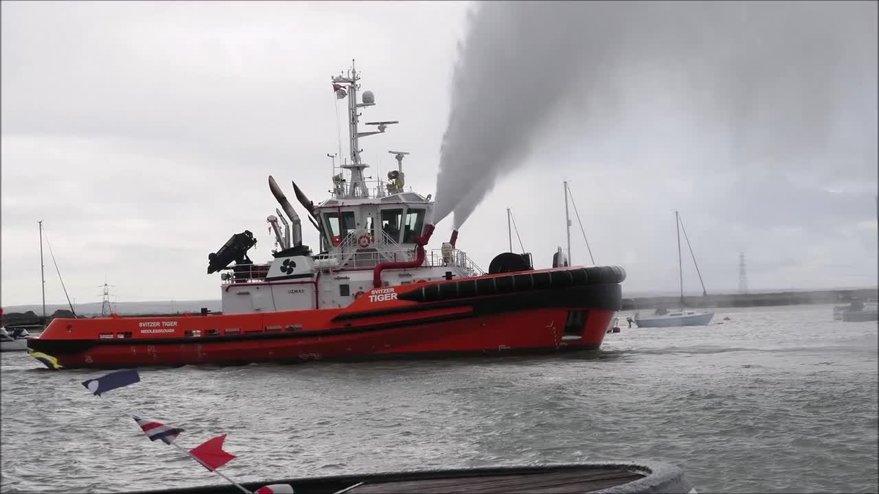 Modern tugboat's spectacular demo alongside vintage tug in Kent, UK