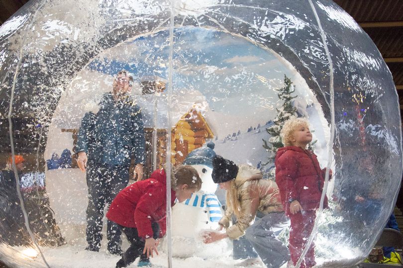 Enchanting winter fair in countryside town on edge of Surrey with ice ...
