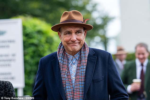 Vinnie Jones looks loved-up with girlfriend Emma Ford at 27th Goodwood ...