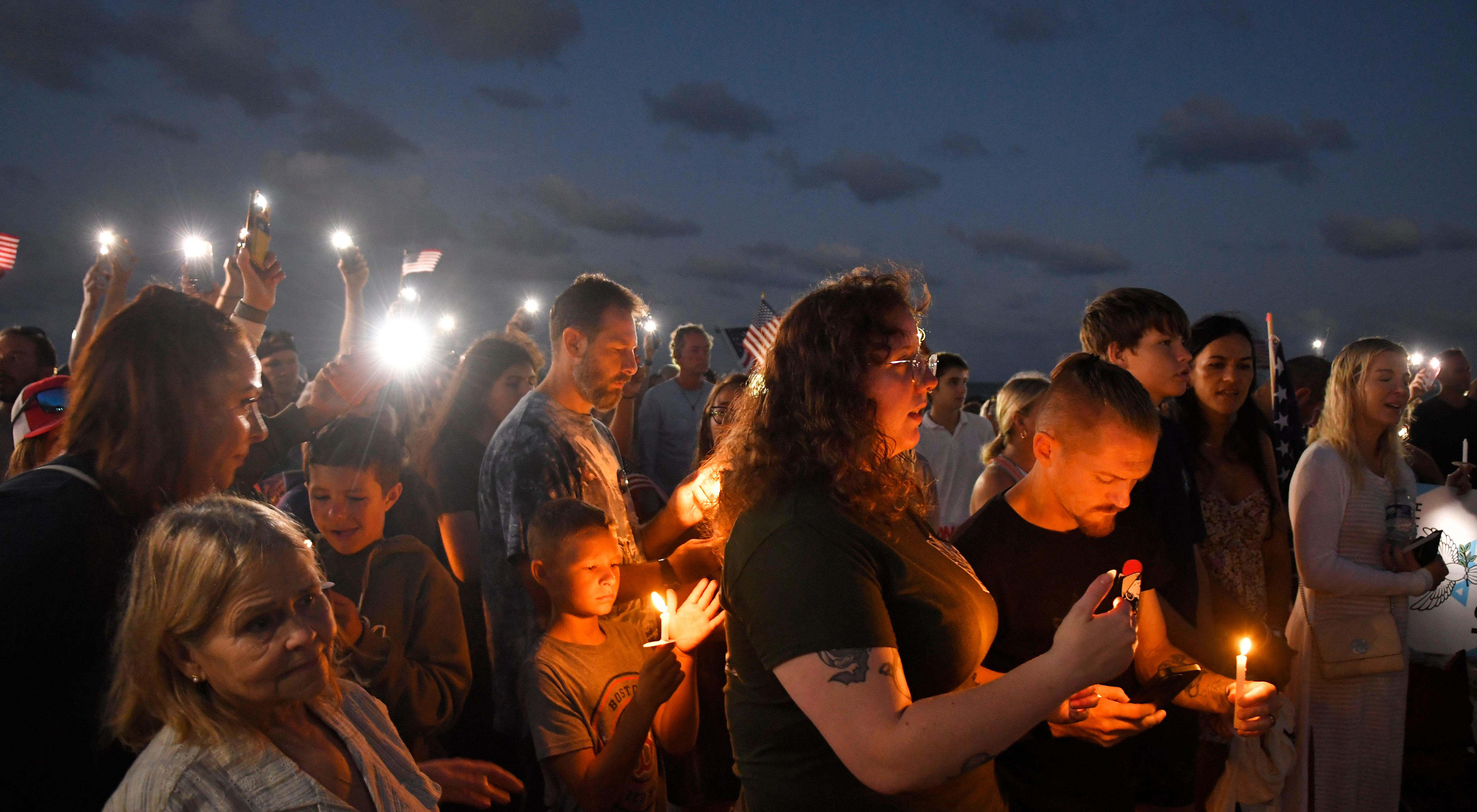Hundreds of people gather at Brevard beach to honor conservative ...