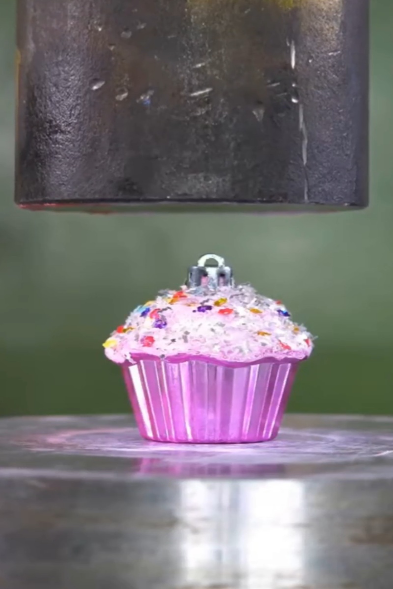 Hydraulic press crushing cupcake ornament