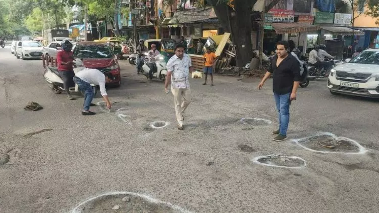 ‘Where is the MLA?’: Bengaluru residents mark potholes in protest; MLA ...