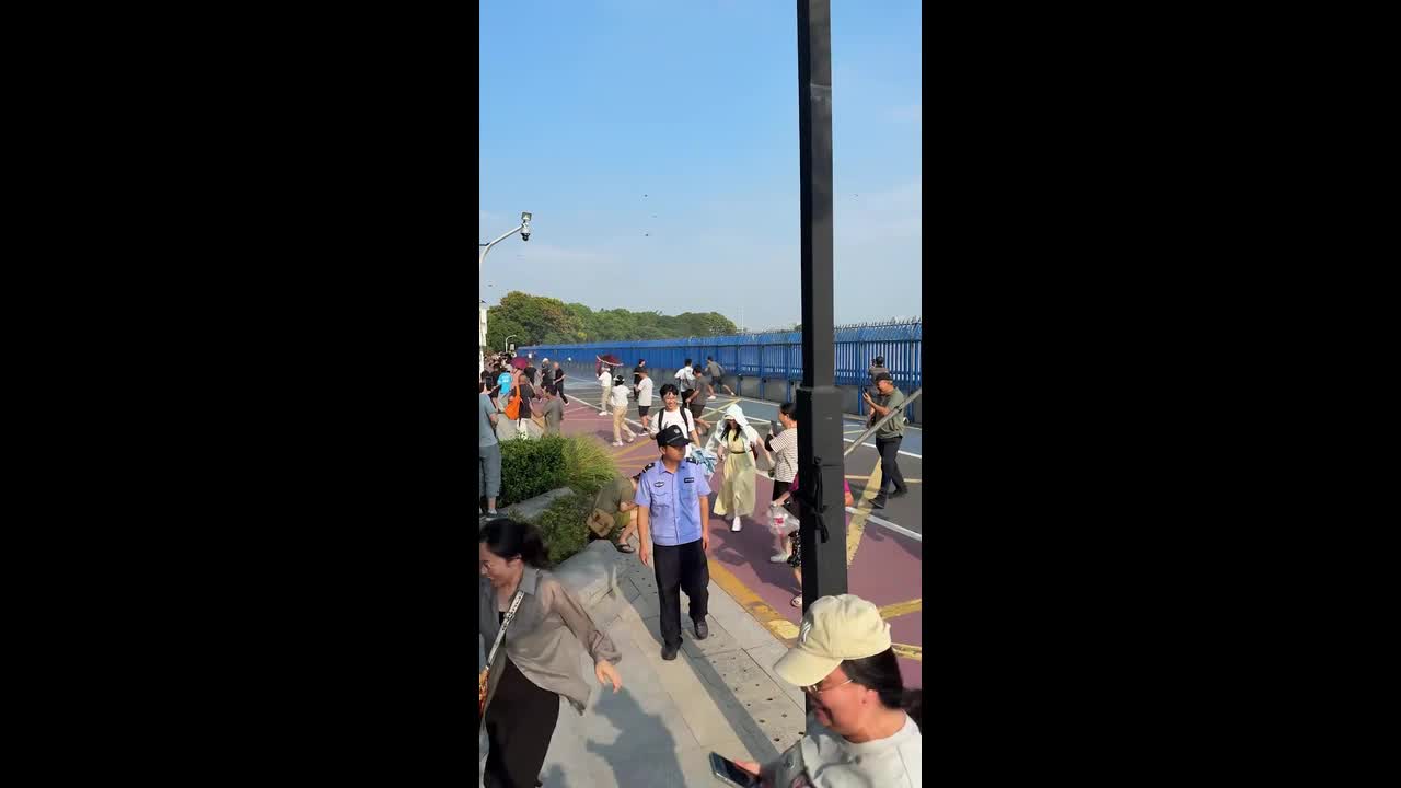 Wave crashes into sea defence sending tourists running