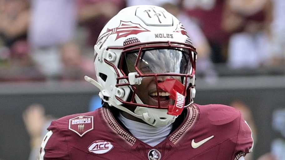 FSU football speedster Micahi Danzy breaks the rock after running by ...