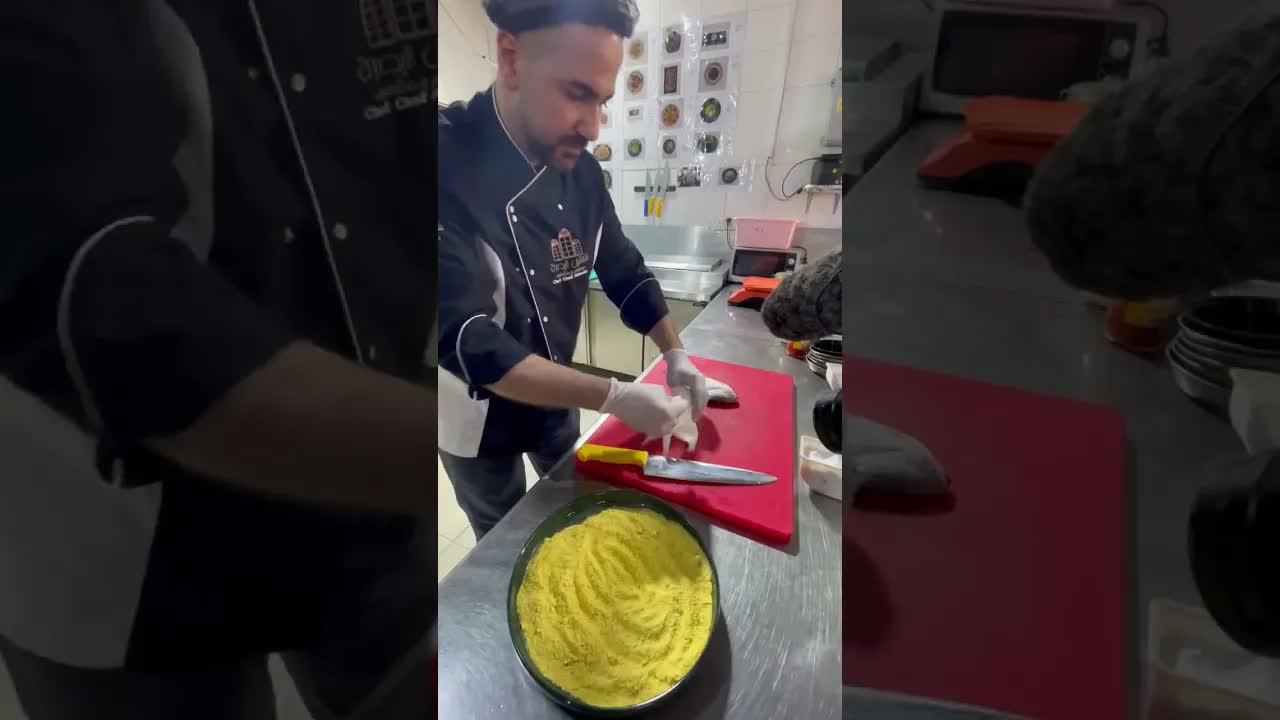 iraqi chef prepares seafood in basrah, iraq