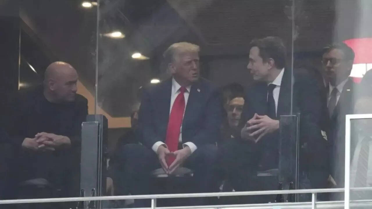Elon Musk makes ‘pyramid hand symbol’ as he reunites with Donald Trump ...