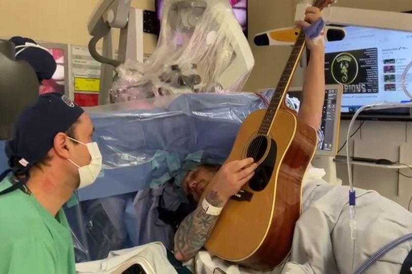 Devon dad plays guitar while surgeons operate on his brain