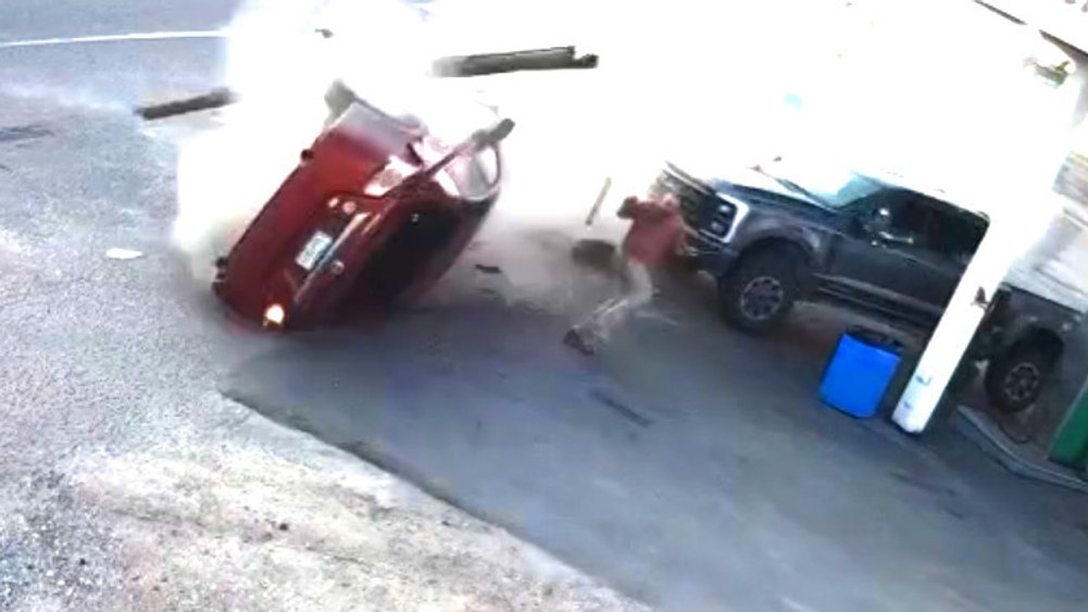 Crash car misses man by inches