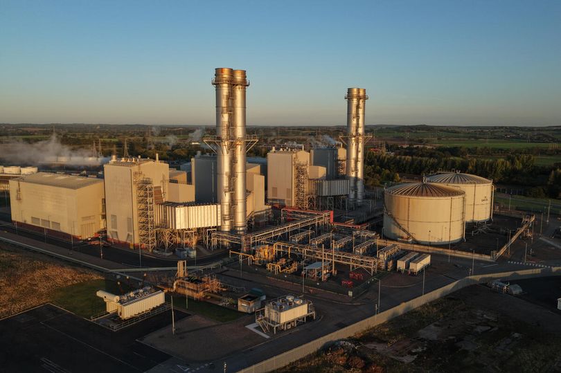 Greenpeace activists climb 75m-tall chimney stacks at Newark power station