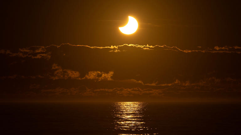 See the sun transform into a fiery crescent in breathtaking photos of ...