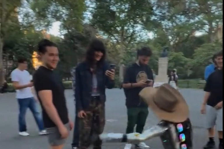 Viral robot filmed 'throwing punches' at people in the street before ...