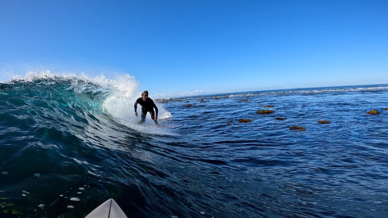 Surfing a sketchy reef break at dead low tide