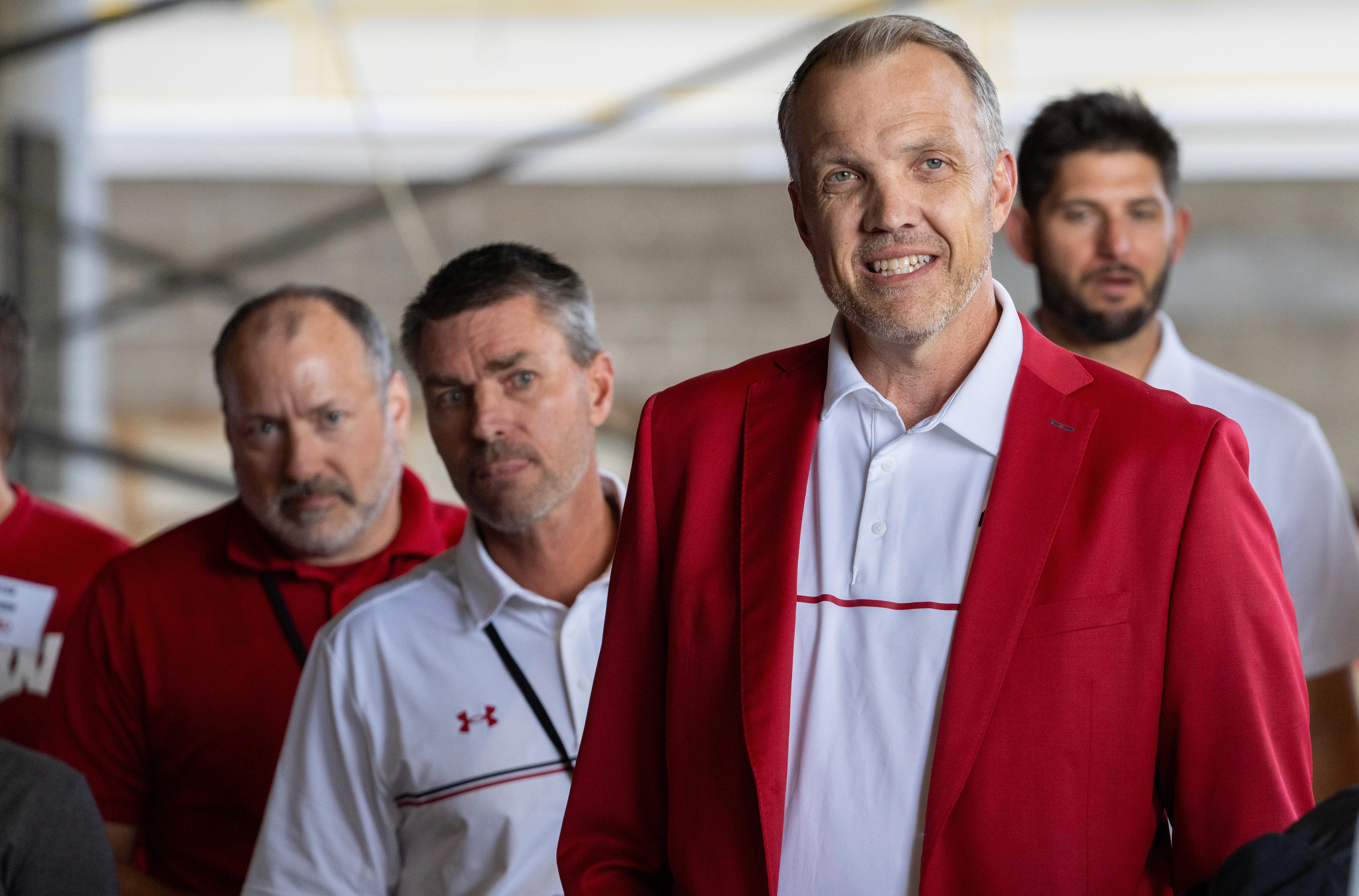 Wisconsin AD Chris McIntosh attends Badger volleyball match with notable former NFL coach