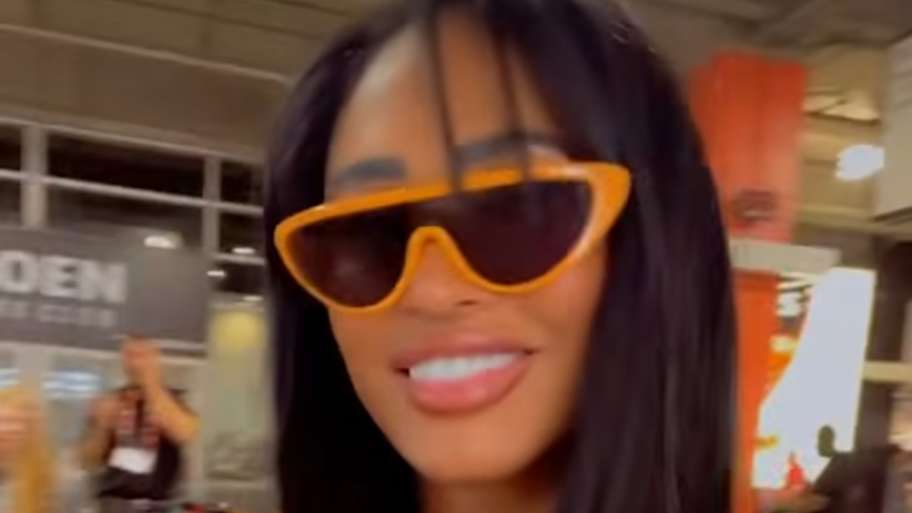 Shedeur Sanders' mom Pilar flexes eye-catching orange '12' top at ...